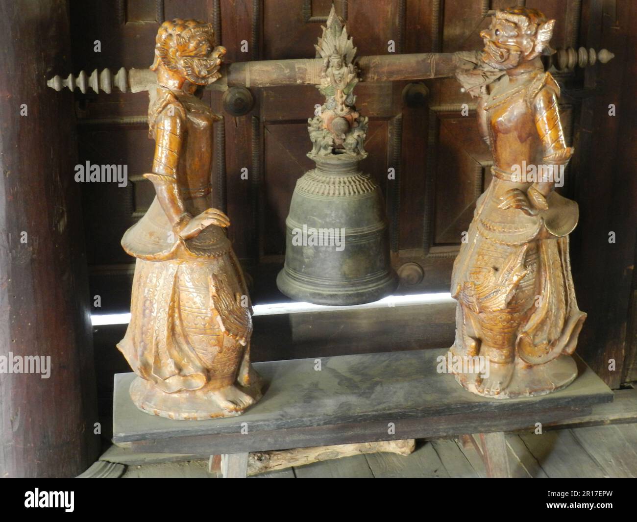 Myanmar, Mandalay: two carved wooden bell-bearers in the Shwe In Bin ...