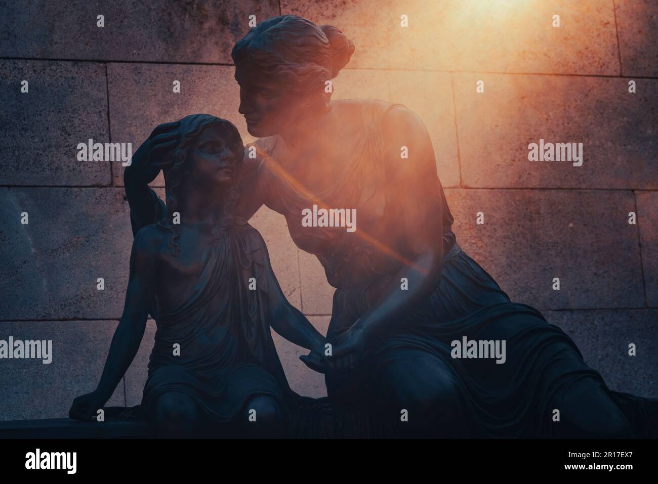 A statue depicting a caring mother and her child, sunshine, art Stock ...