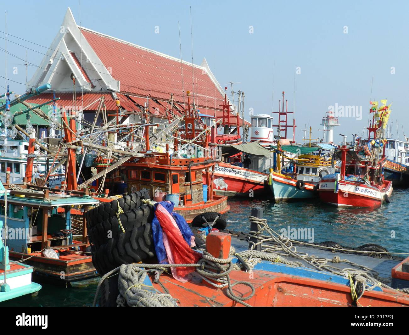 Thailand, Chonburi, Ko Si Chang Island: colourful jumble of spars and masts in the harbour Stock ...