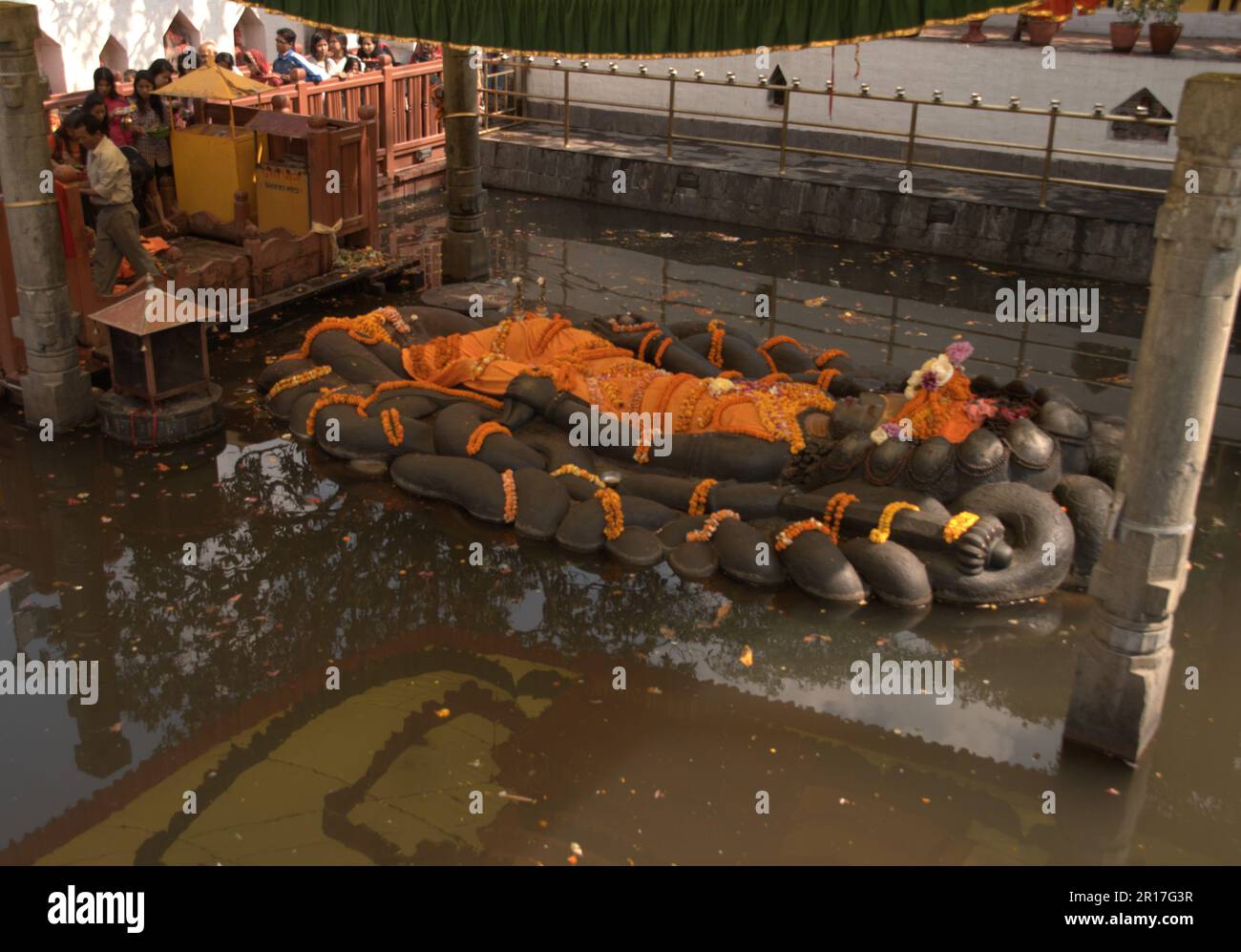 Nepal, Kathmandu, Budhanilakantha: Puja ceremony, with Vishnu lying on ...