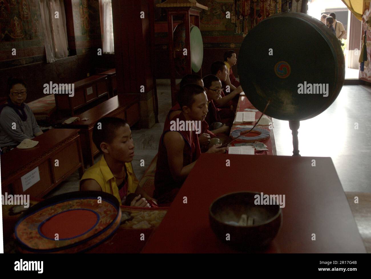 Nepal, Kathmandu: Buddhist monks in the temple at Bodhnath, chanting ...