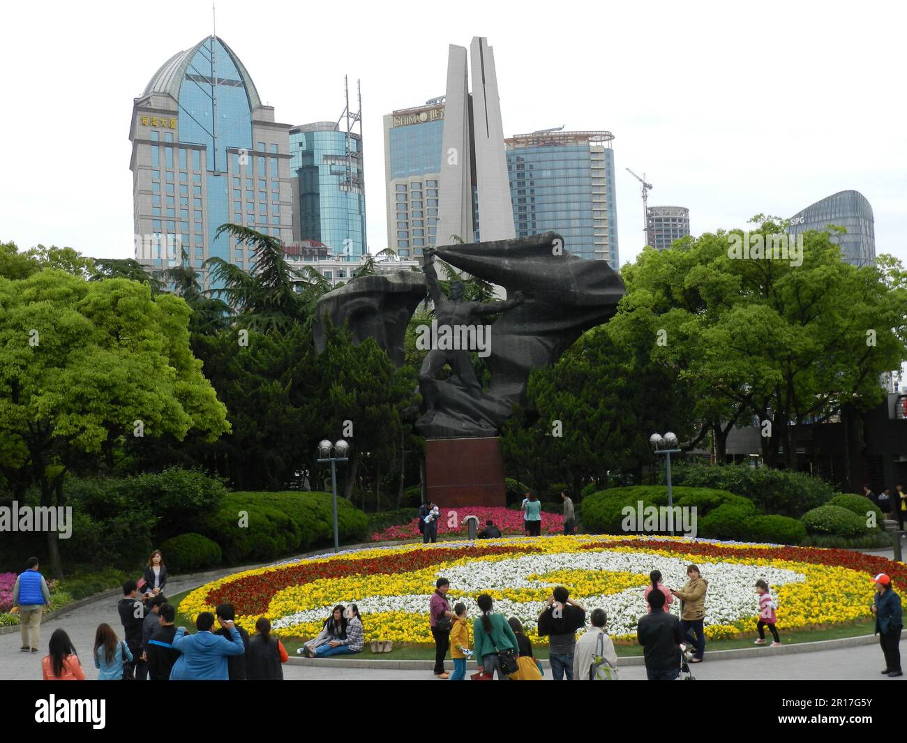 People's Republic of China, Shanghai: allegorical statue and flower ...