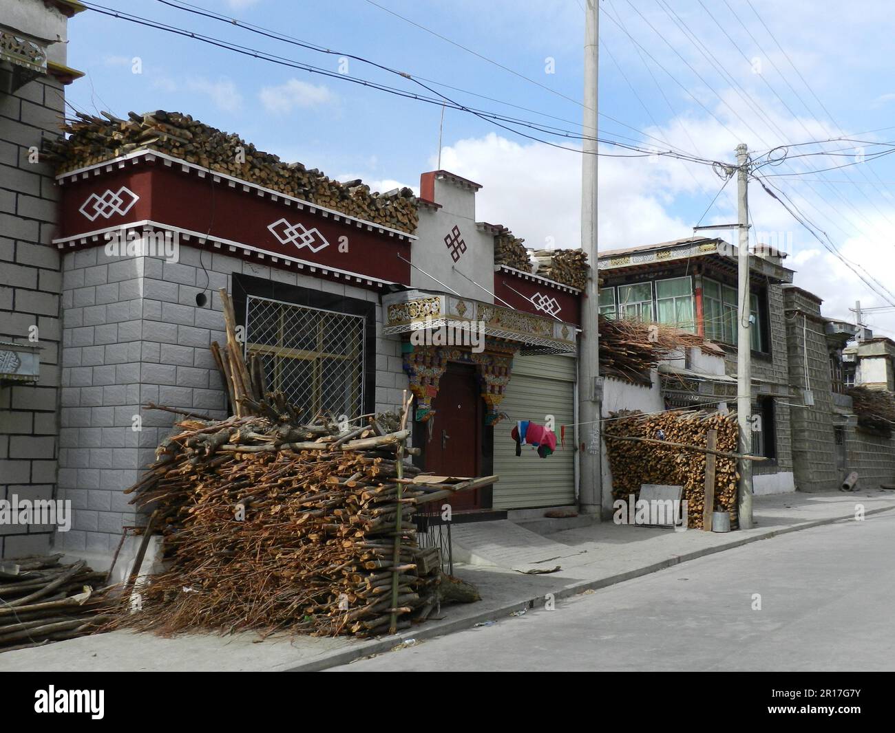Tibet, Tsetang: typical Tibetan houses in the old quarter with stocks ...
