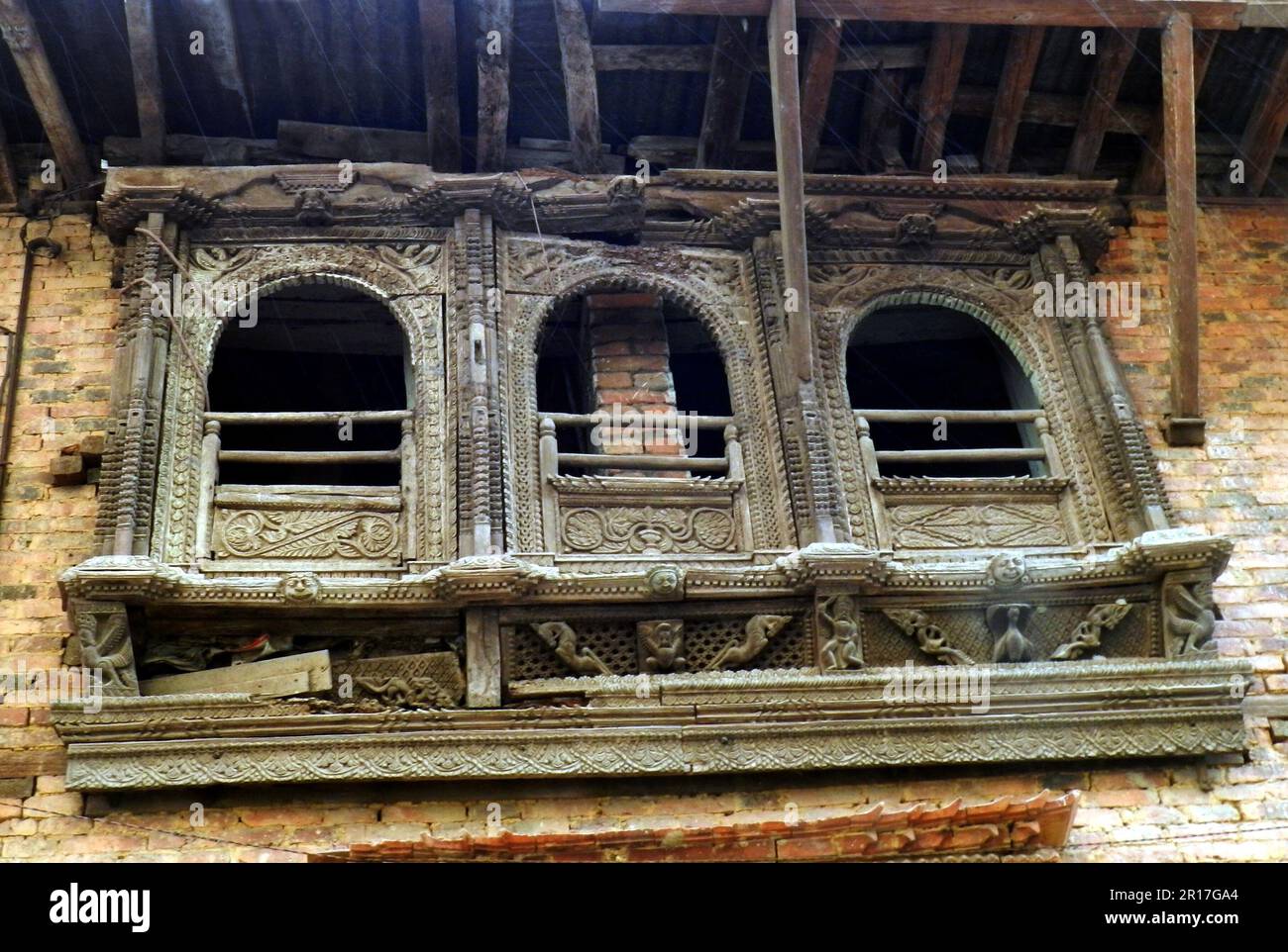 Nepal, Dhulikhel: unrestored Newari architecture: finely carved window ...