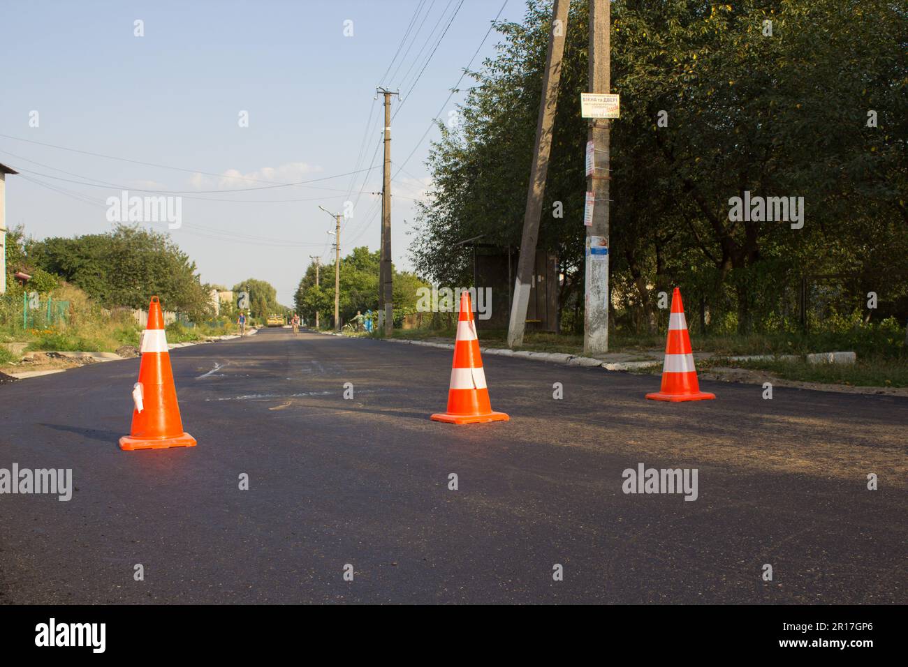 new paved road closed with red cones Stock Photo - Alamy
