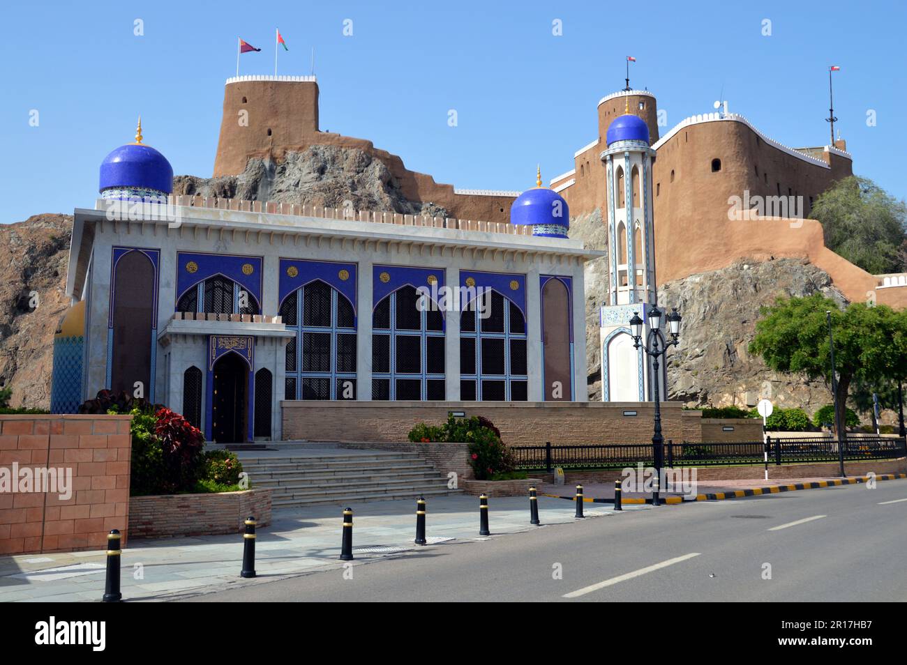 Oman, Muscat: blue-tiled Al Khor Mosque, with the restored Mirani Fort ...