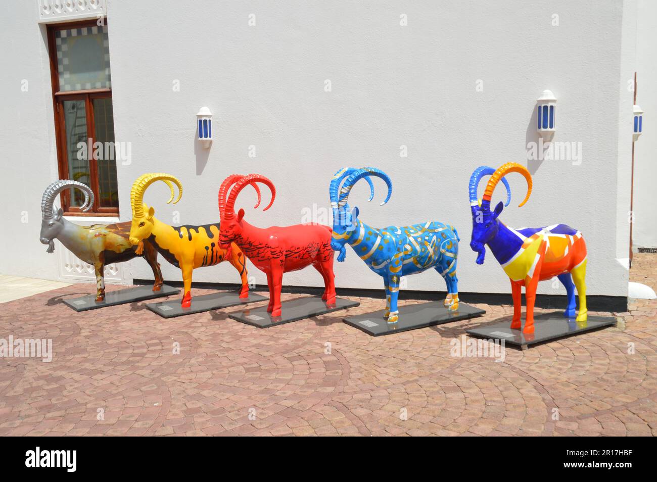 Oman, Muscat: colourful goats in the grounds of the Bait Al Zubair ...
