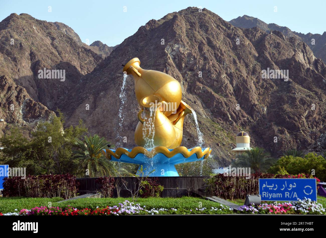 Oman, Muscat: golden water pitchers form a fountain on one of the ...