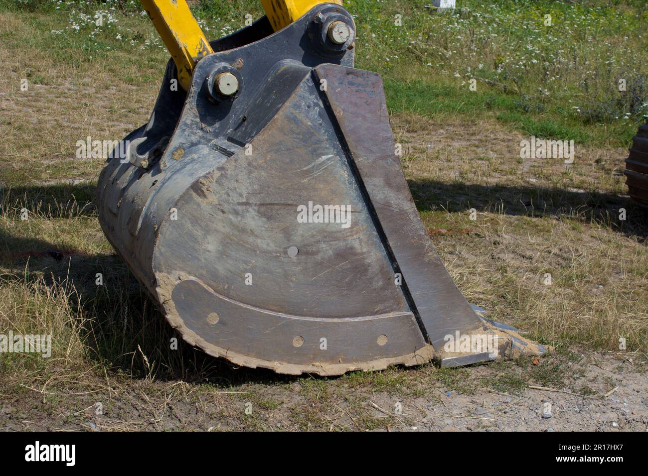 Close-up bucket of excavator on the ground Stock Photo - Alamy