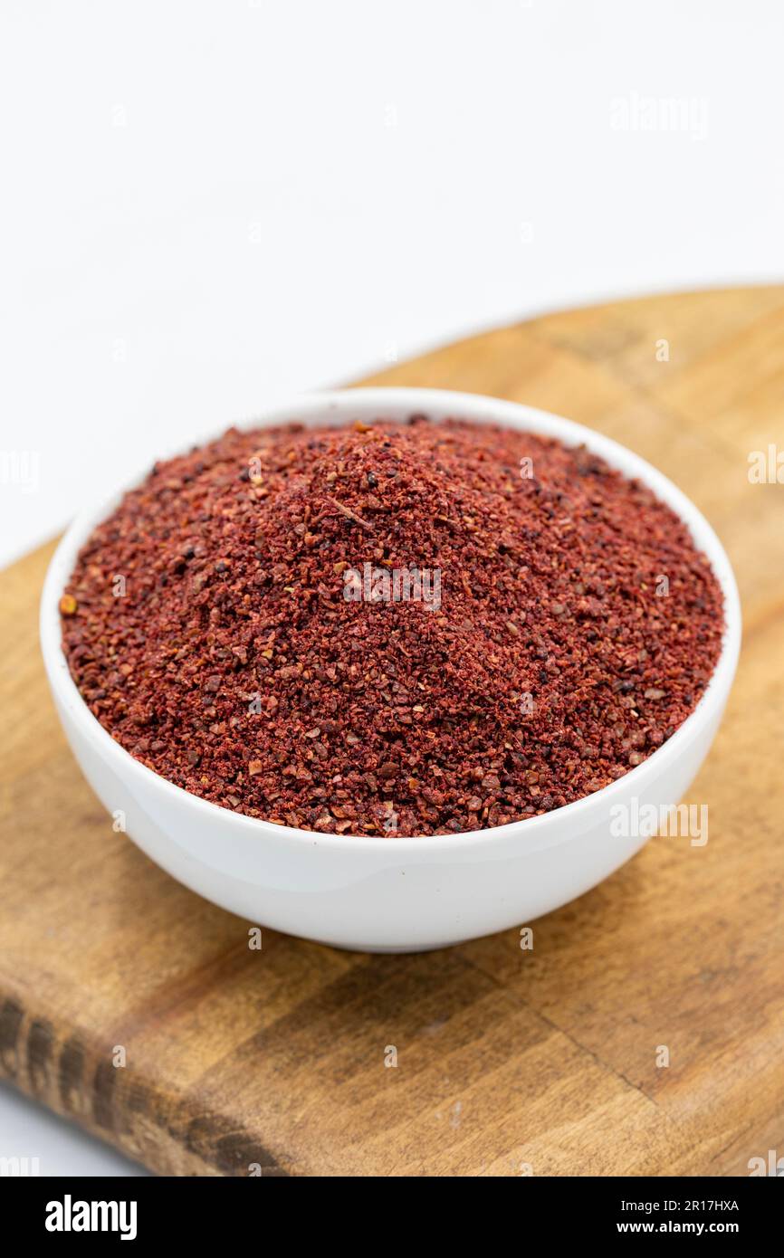 Sumac isolated on white background. Dried ground red Sumac powder ...