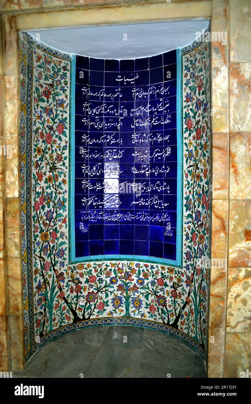 Iran, Shiraz: poem in Farsi with a floral faience surround in the tomb ...