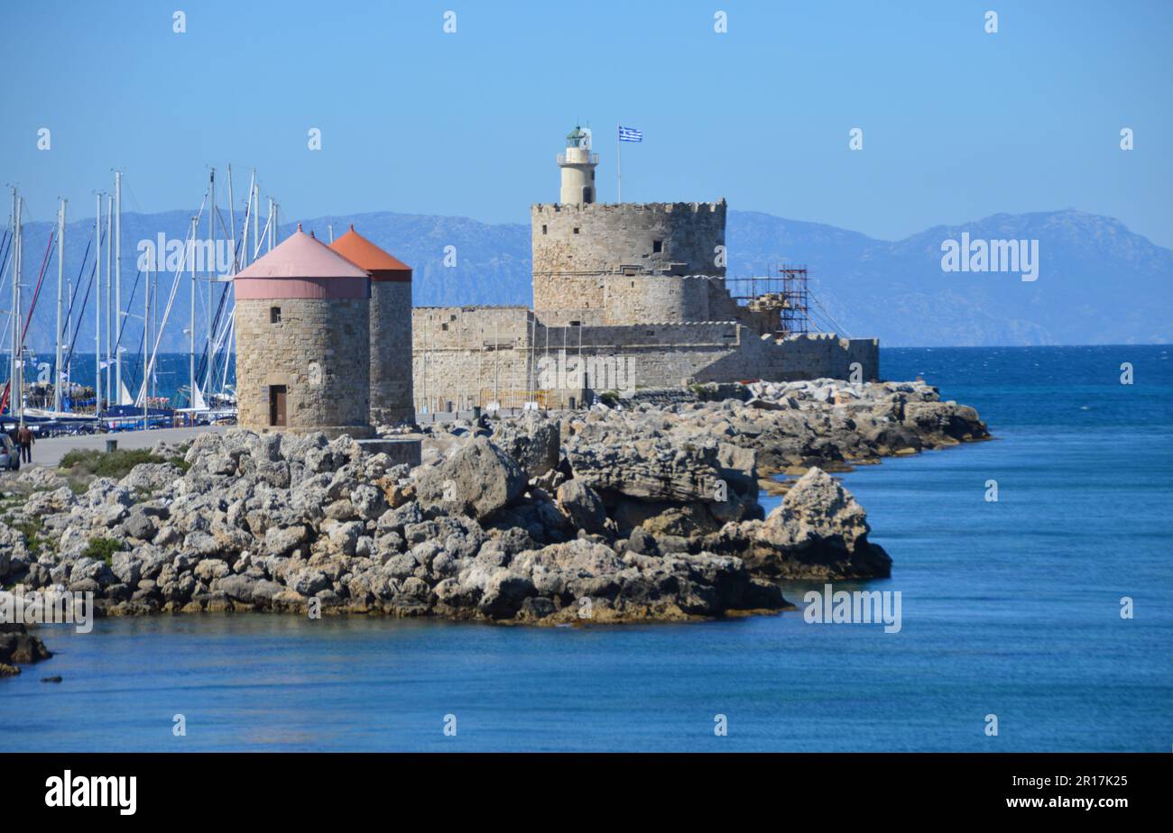 Greece, Island of Rhodes: the mole of Mandraki Harbour with the ...