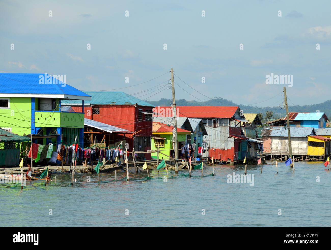The Philippines, Samar Island, Calbayog: colourful waterside dwellings ...