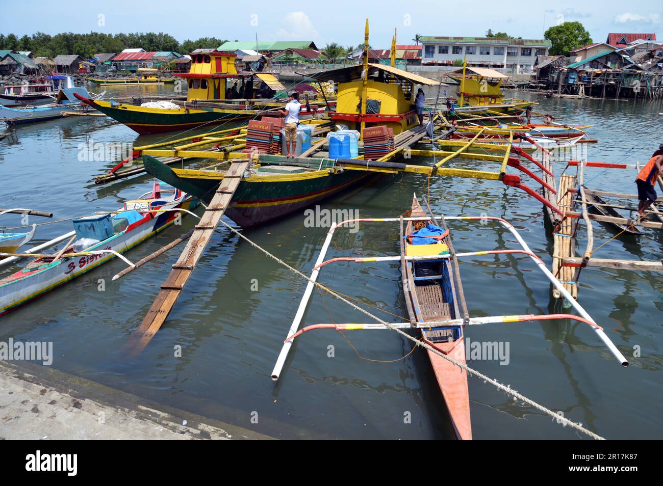 The Philippines, Samar Island, Calbayog: colourful wooden fishing boats ...