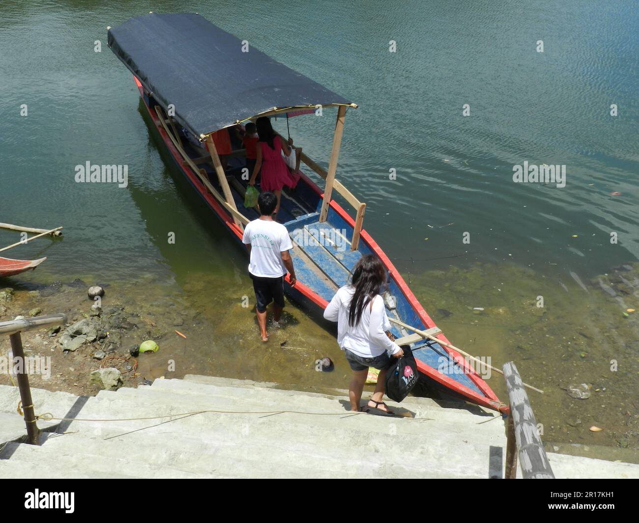 The Philippines, Samar Island: boarding a boat on the Oquendo River to ...