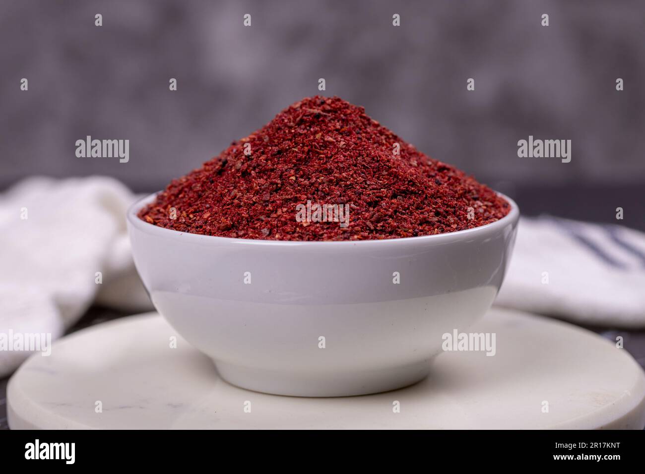 Sumac on dark background. Dried ground red Sumac powder spices in ...