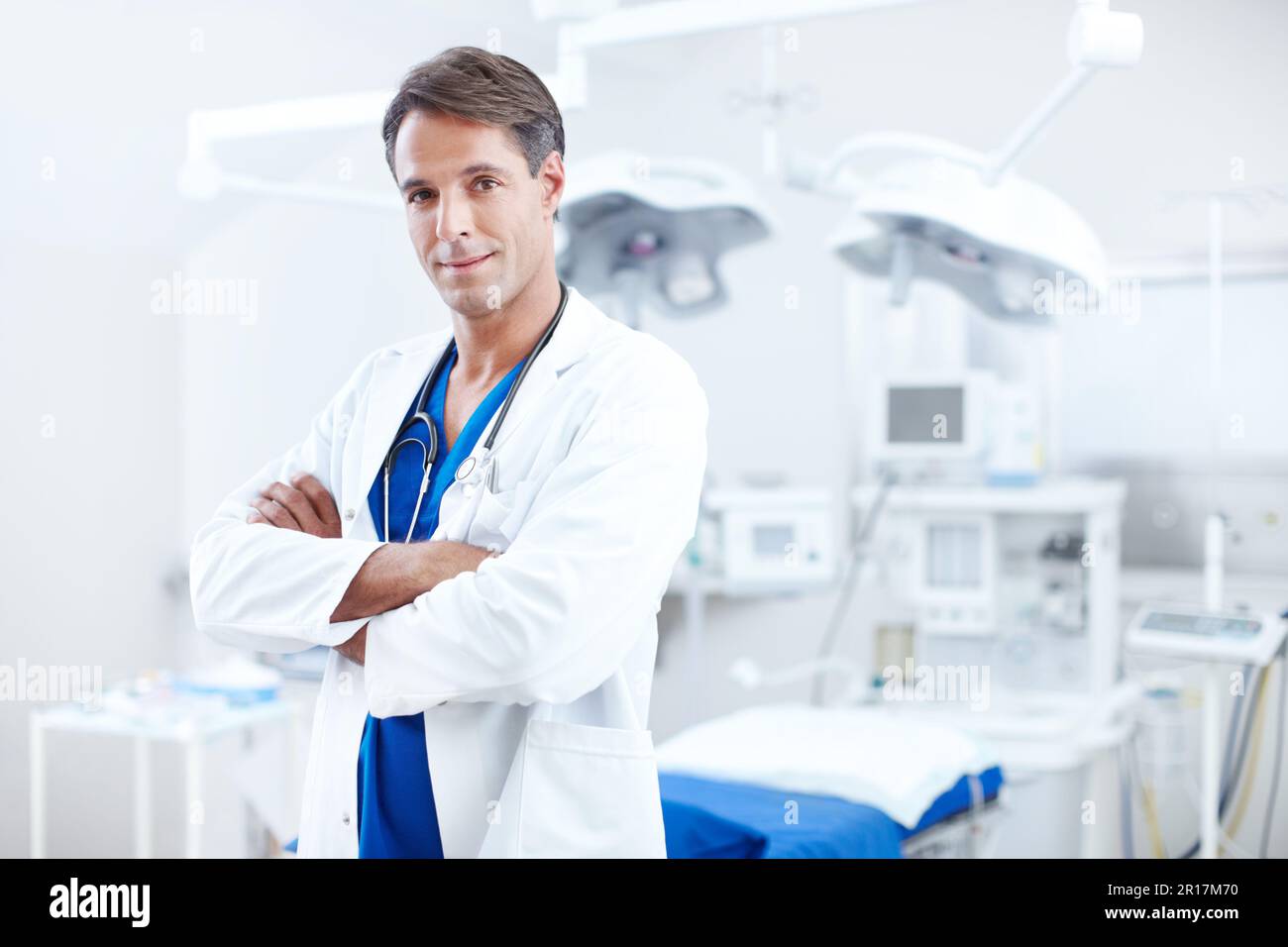 The perfect doctor. A confident male doctor standing with his arms ...