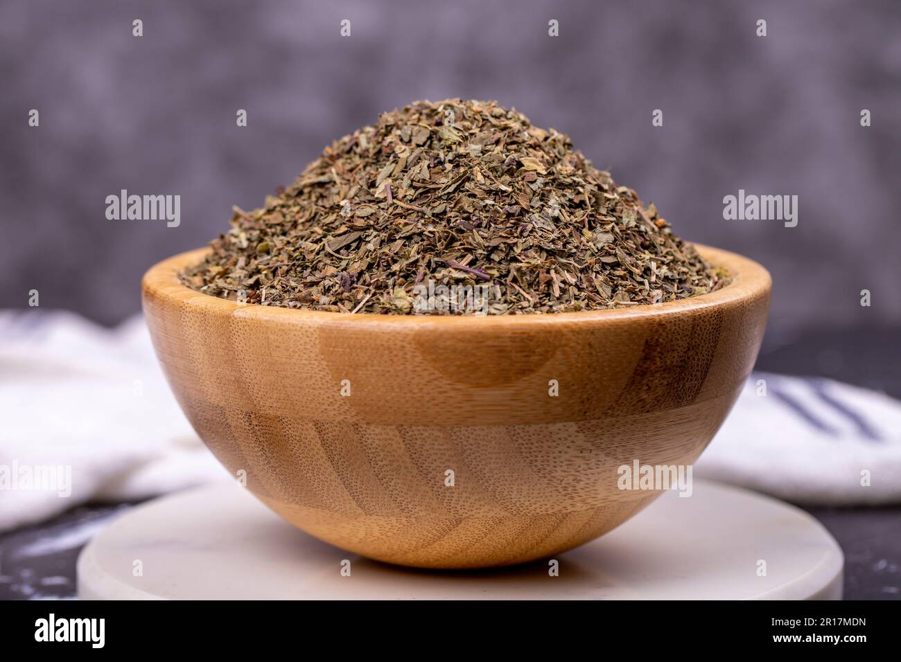 Dried crushed basil on dark background. Dried ground basil powder ...