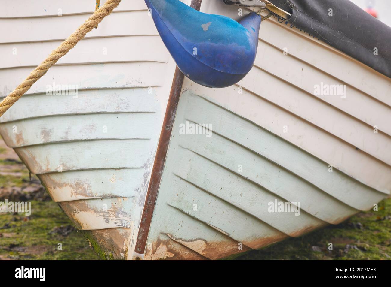 A close-up of the bow of a small boat, on the shore in Teignmouth ...