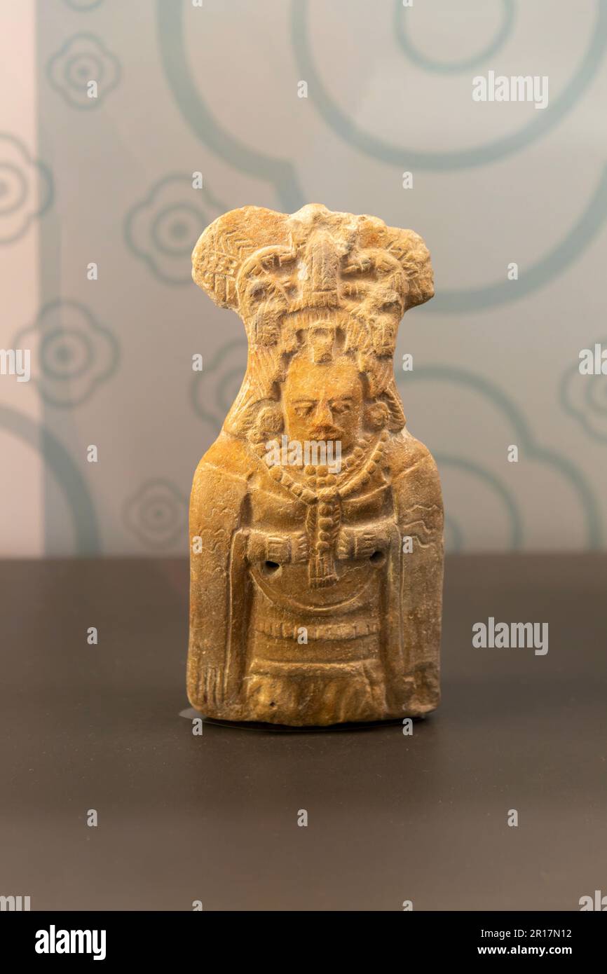 Ceramic figurine model of woman with mantle cloak, from Jaina, Late ...