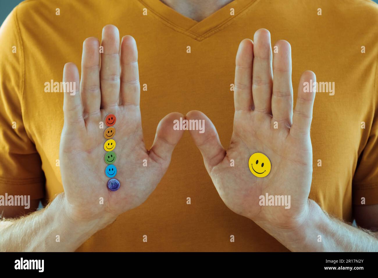 Men's hands with colored emojis in colors of the lgbt flag friendly ...
