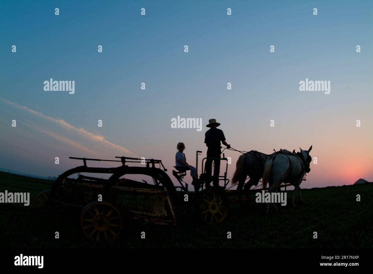 Old Amish Farm with man on plow working fields Lancaster Pennsylvania ...