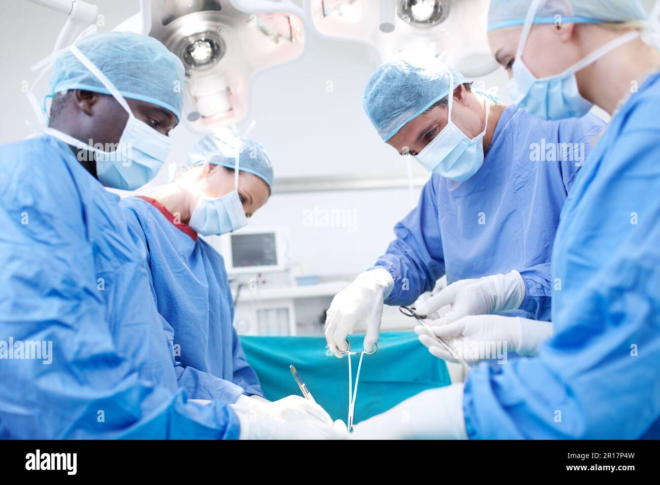 Putting your life in good hands. Side view of medical surgeons ...