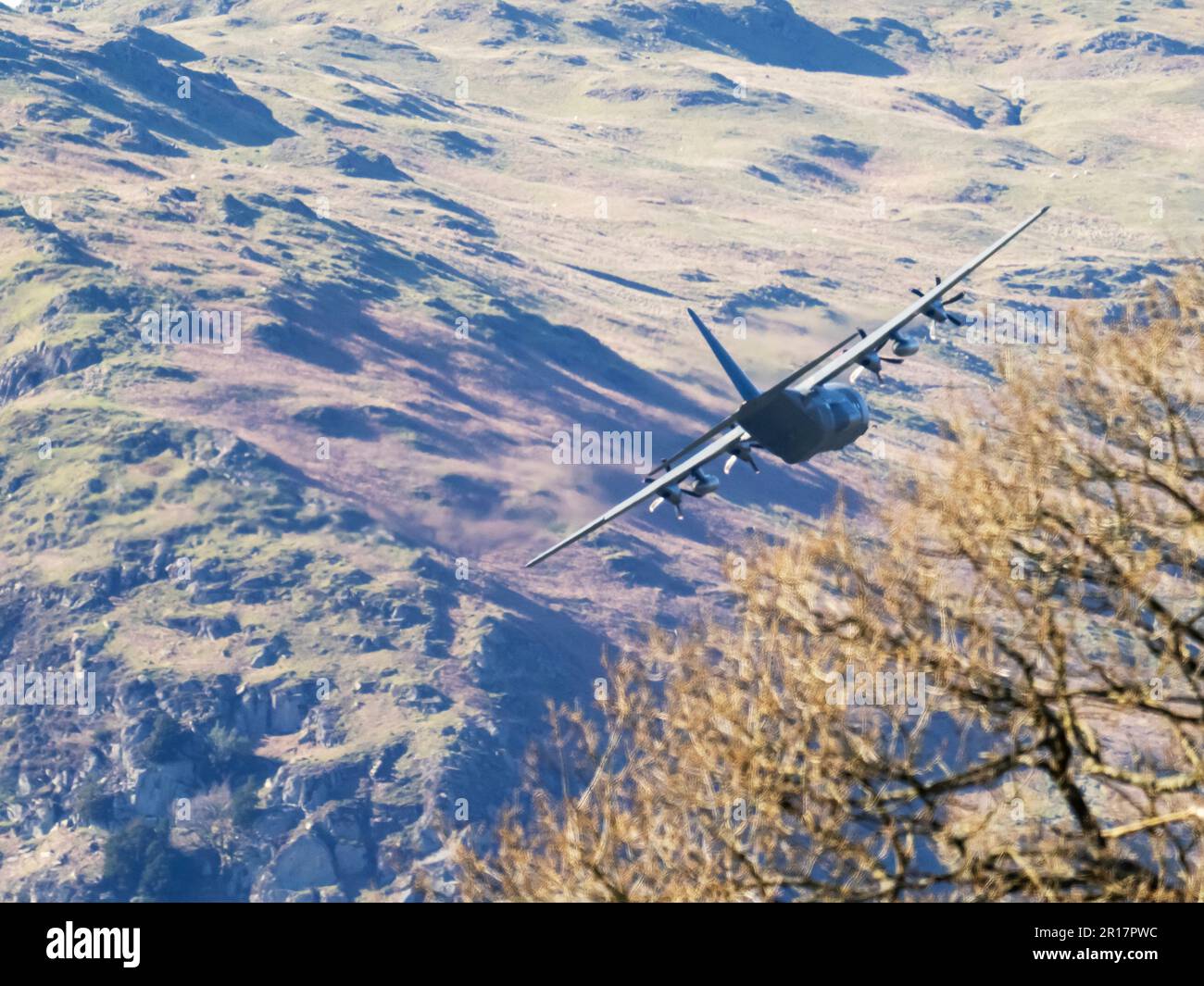 An RAF cargo plane flying over Ambleside in the Lake District, UK Stock ...
