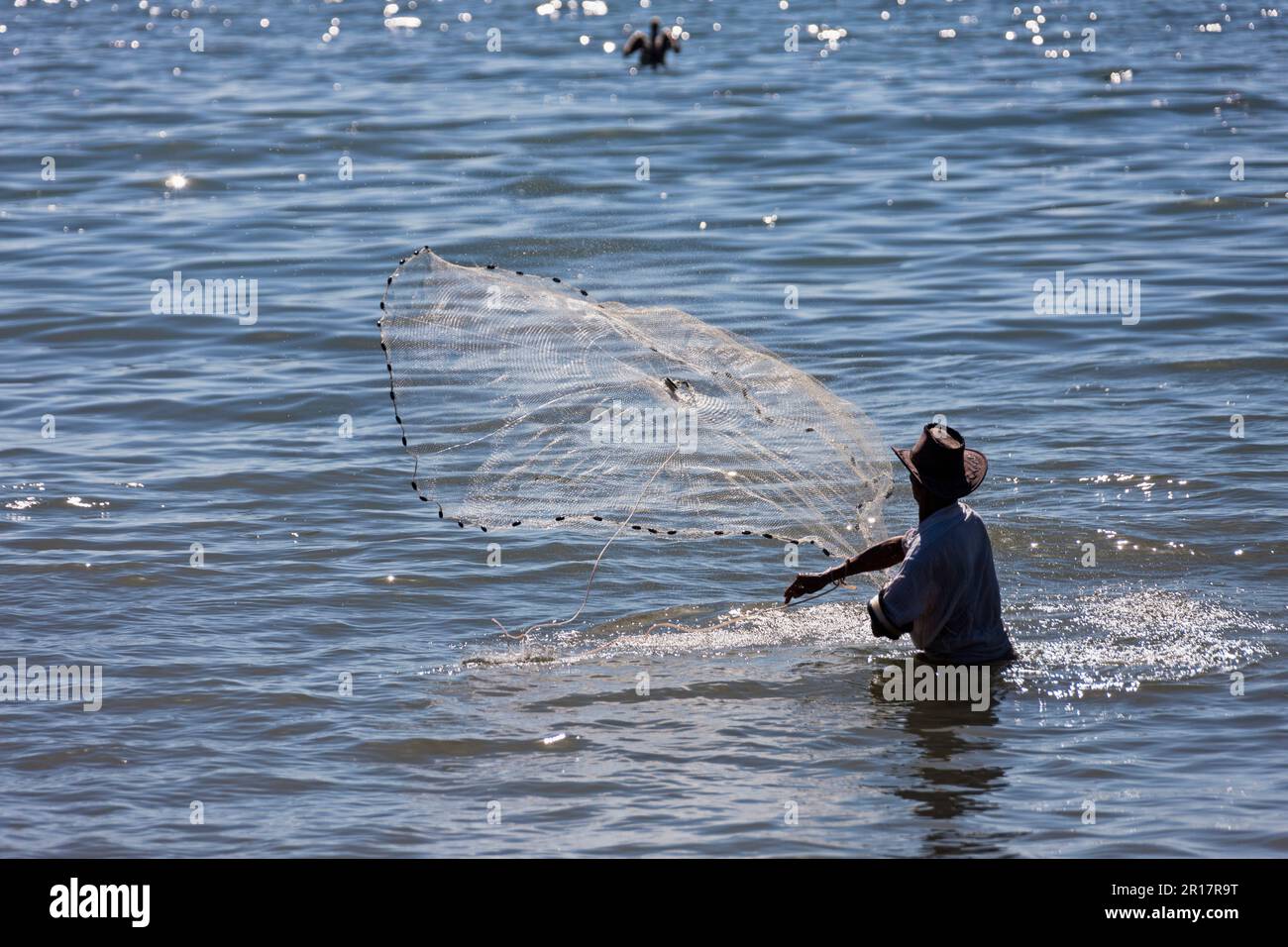 Fisherman spreading fishing net for catching fish in sea, Samara ,Costa ...