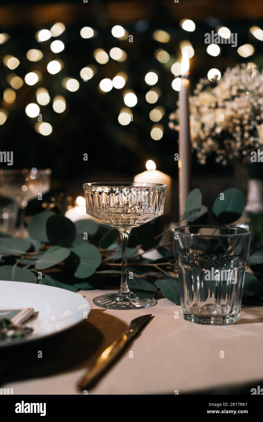 Glass on a served wedding table Stock Photo - Alamy