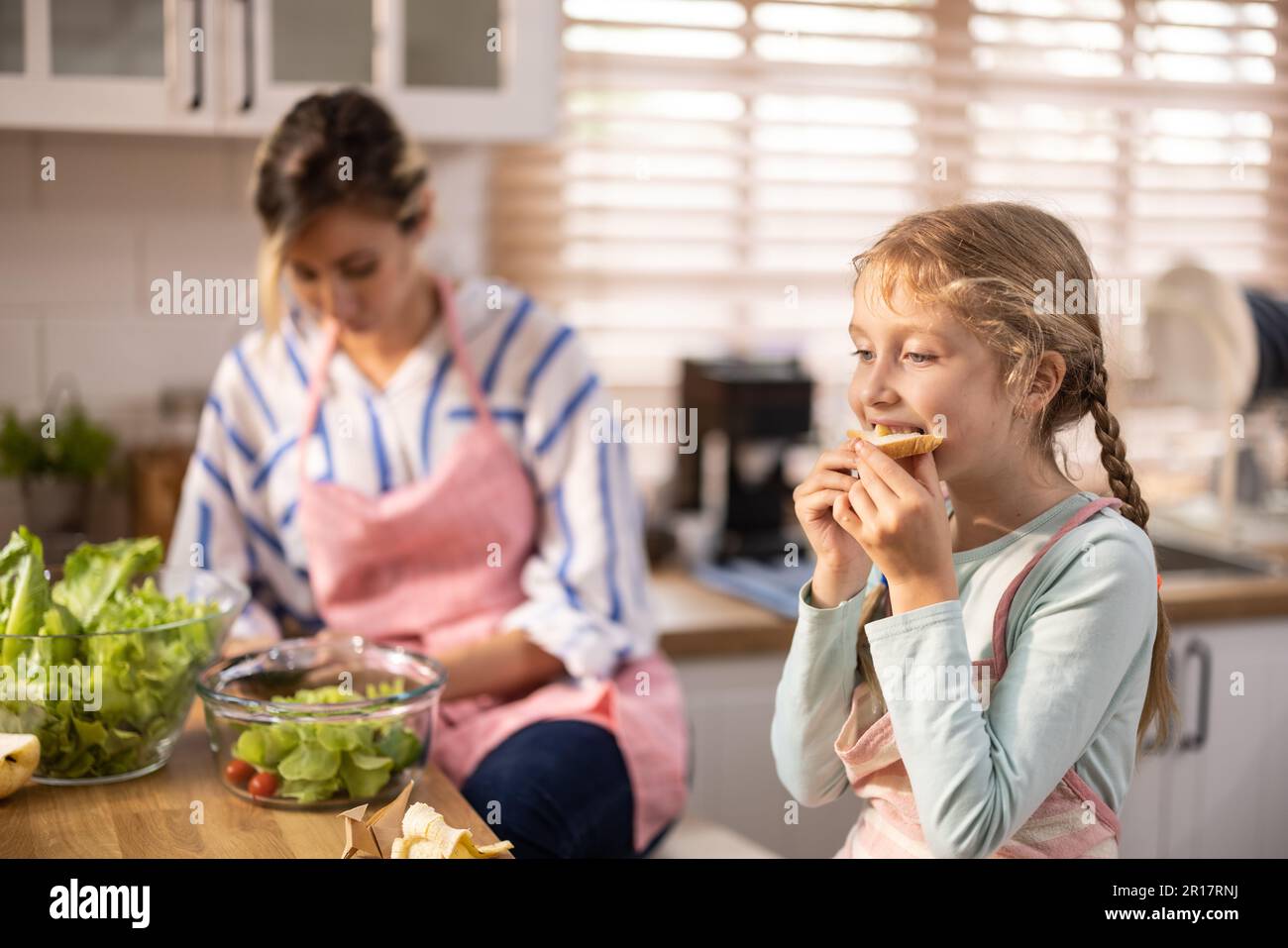 Multi-generational family members explore new and tasteful recipes on a ...