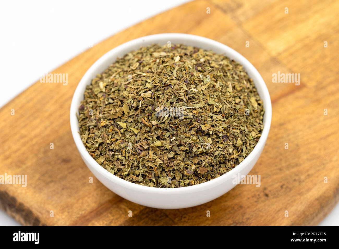 Dried crushed basil isolated on white background. Dried ground basil ...