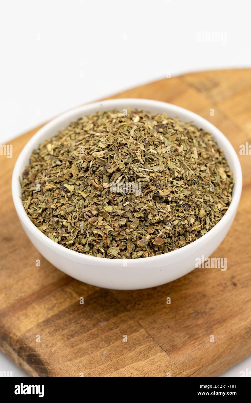 Dried crushed basil isolated on white background. Dried ground basil ...