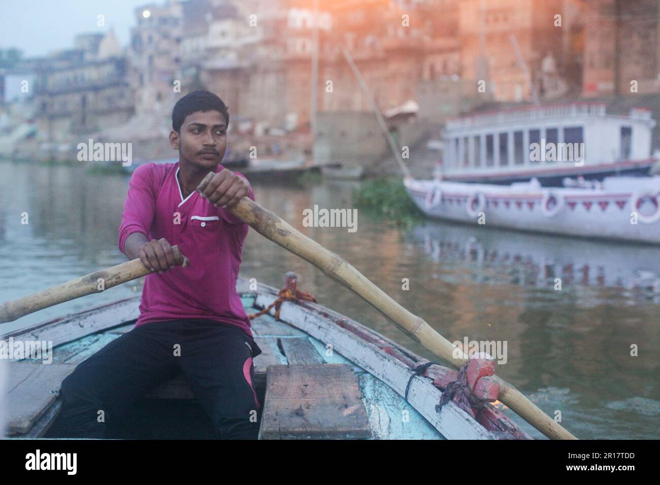 Indian Man Rowing Boat on the River Ganges in India Stock Photo - Alamy