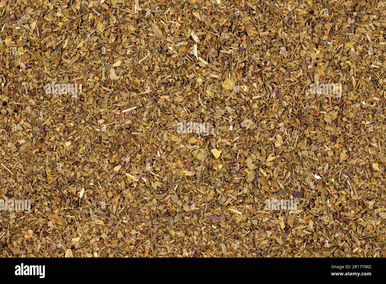 Close-up Dried crushed basil background. Dried ground basil powder ...