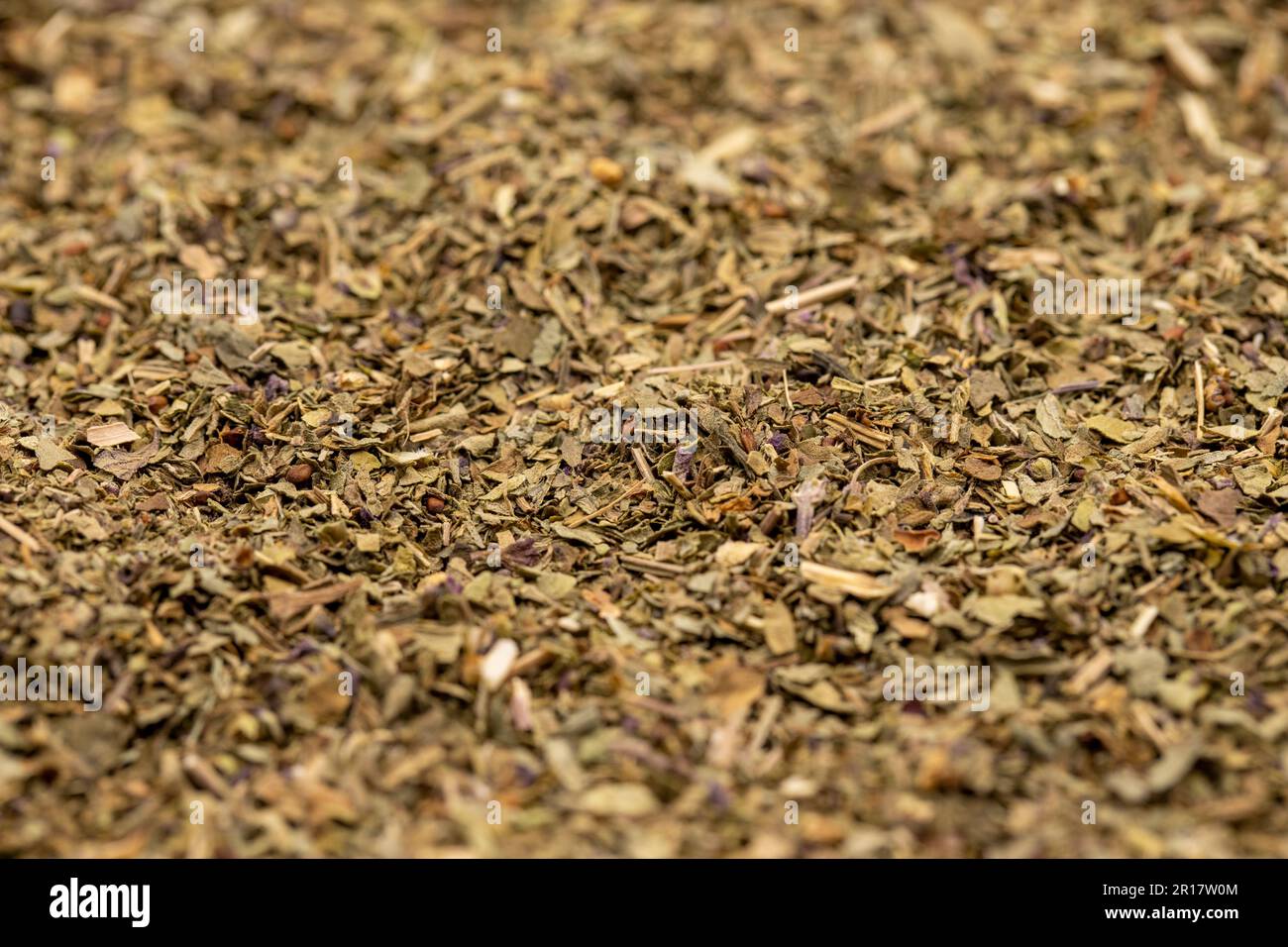 Close-up Dried crushed basil background. Dried ground basil powder ...