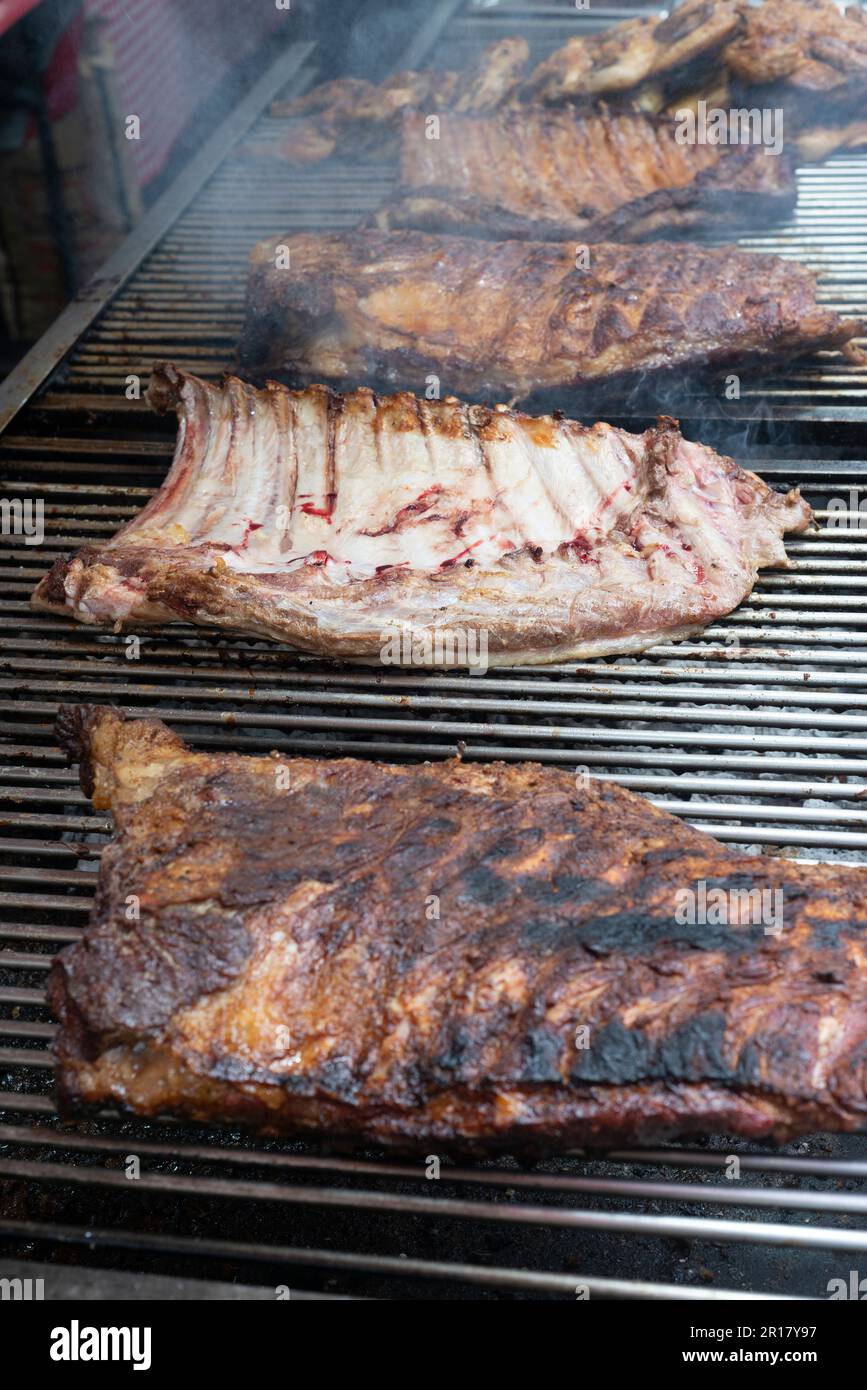 Italy, Street Food Festival, Rack of Pork Ribs Lined Up On a Large ...