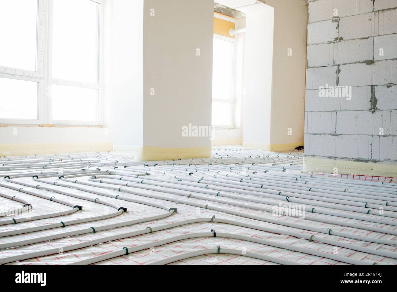 Installation of underfloor heating pipes for water heating. Heating systems. Pipes for ...