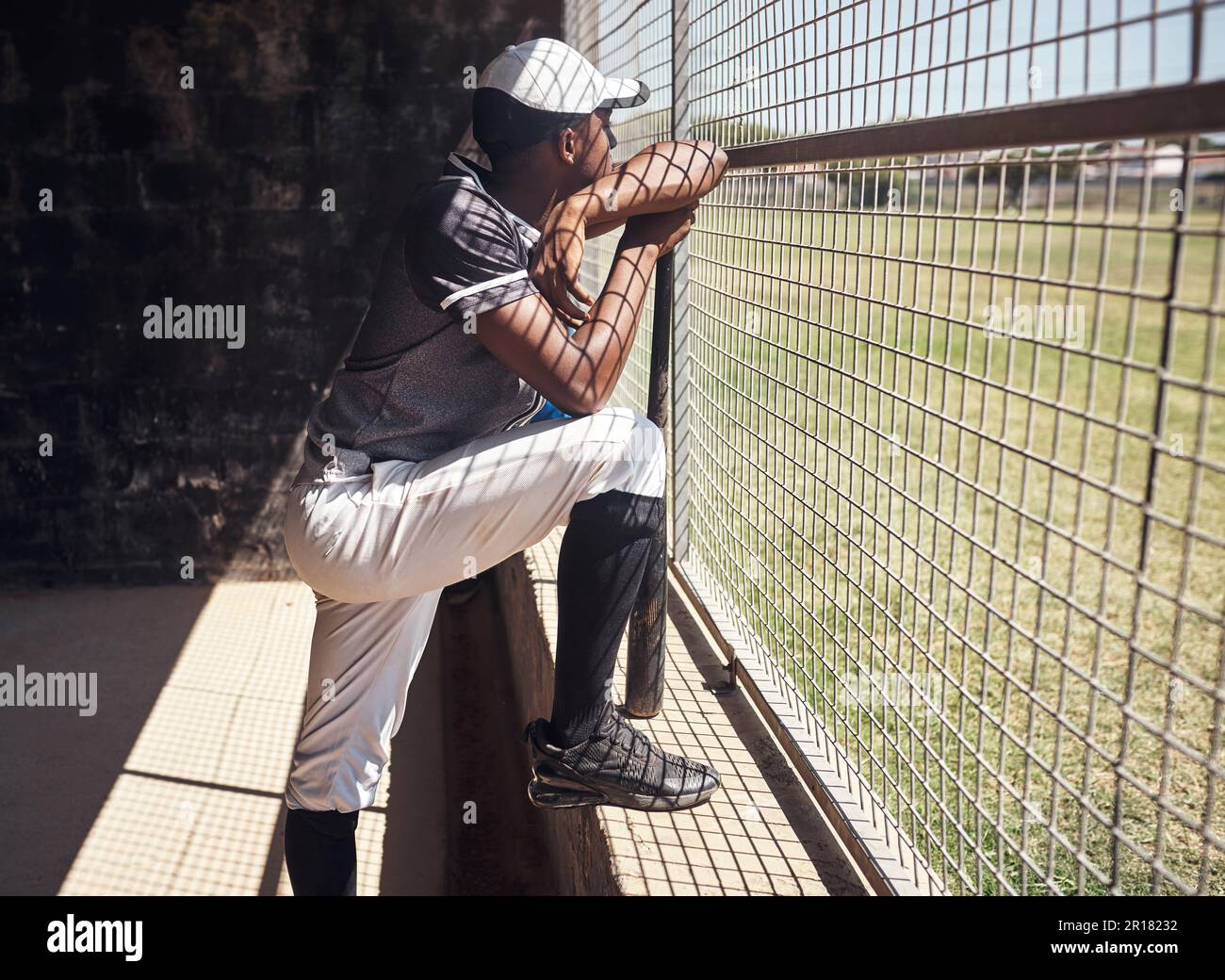 Right where the action is. a young man watching a game of baseball from ...