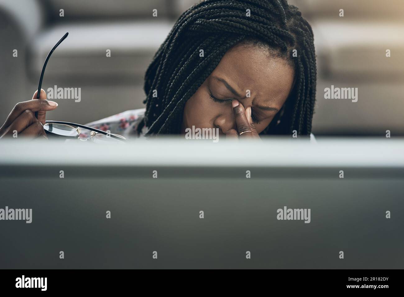 Hard days that lead to headaches. a young woman suffering from stress ...