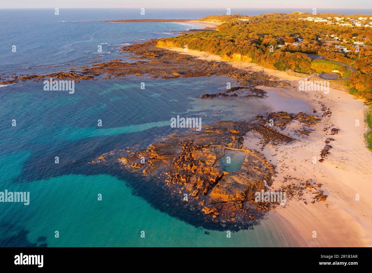 Aerial view of an ocean bathing pool along a rocky coastline at Cape ...
