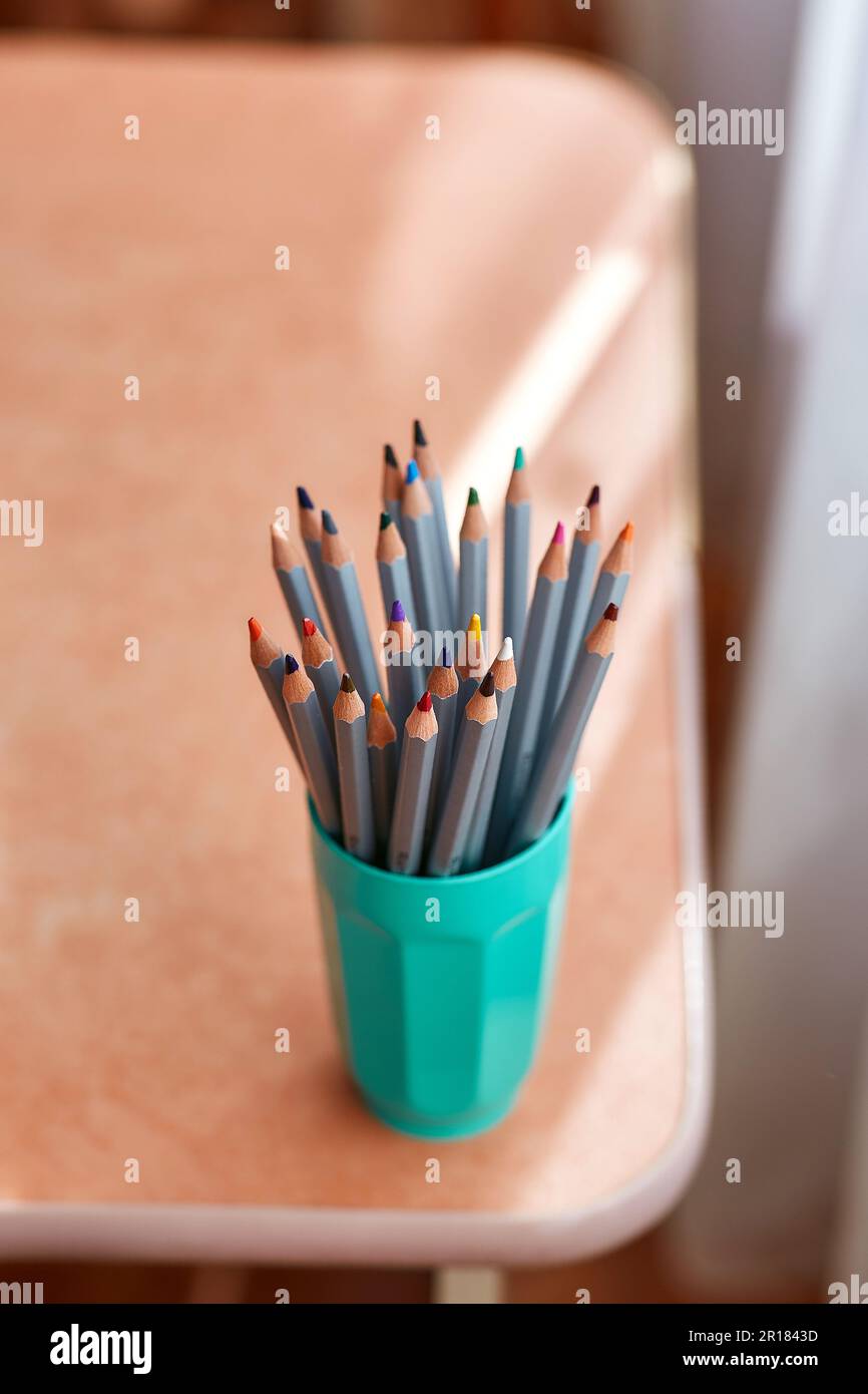 many sharpened colored pencils in a tube side view Stock Photo - Alamy