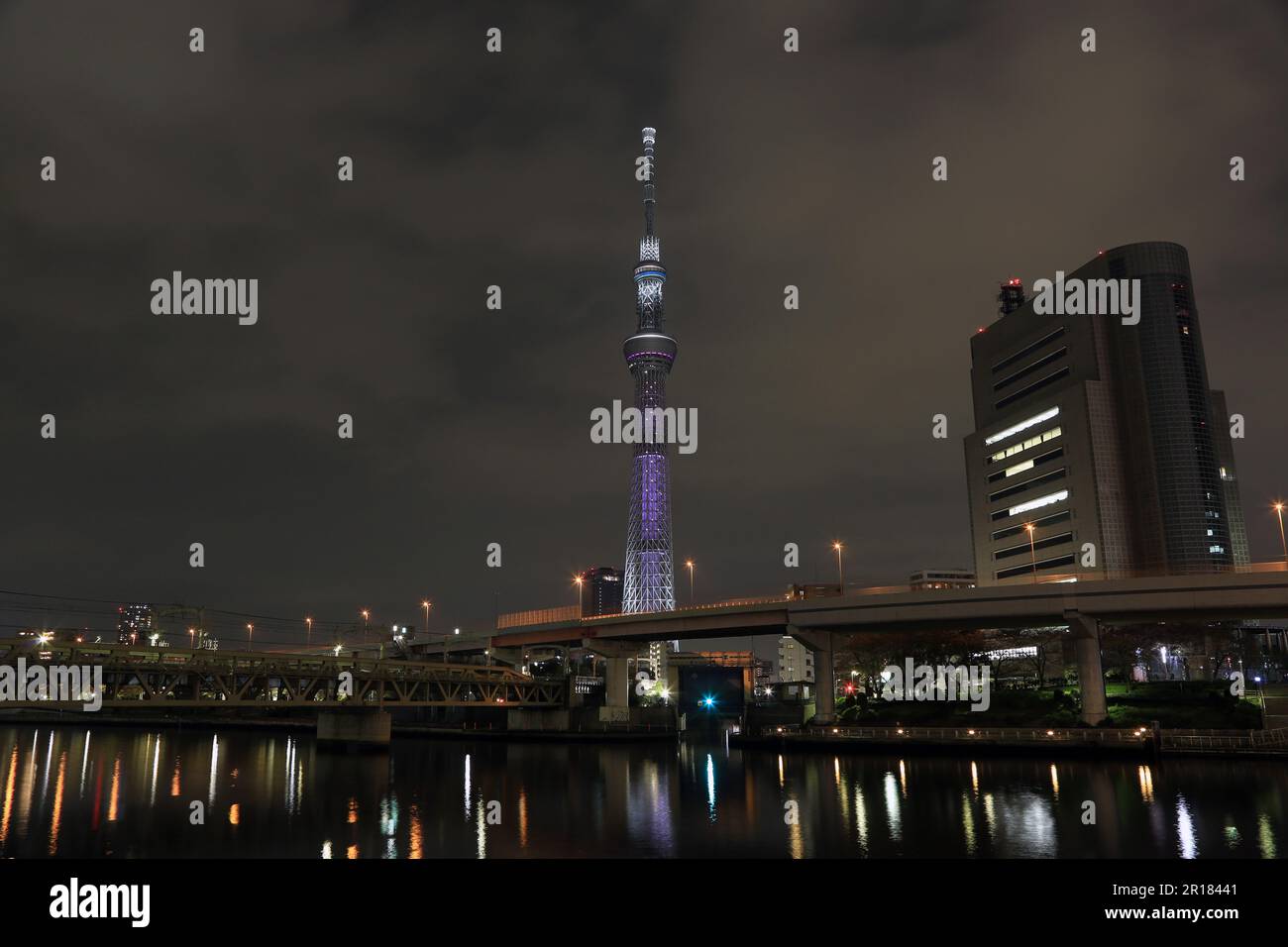 Tokyo sky tree tower lit up in white and purple Stock Photo - Alamy