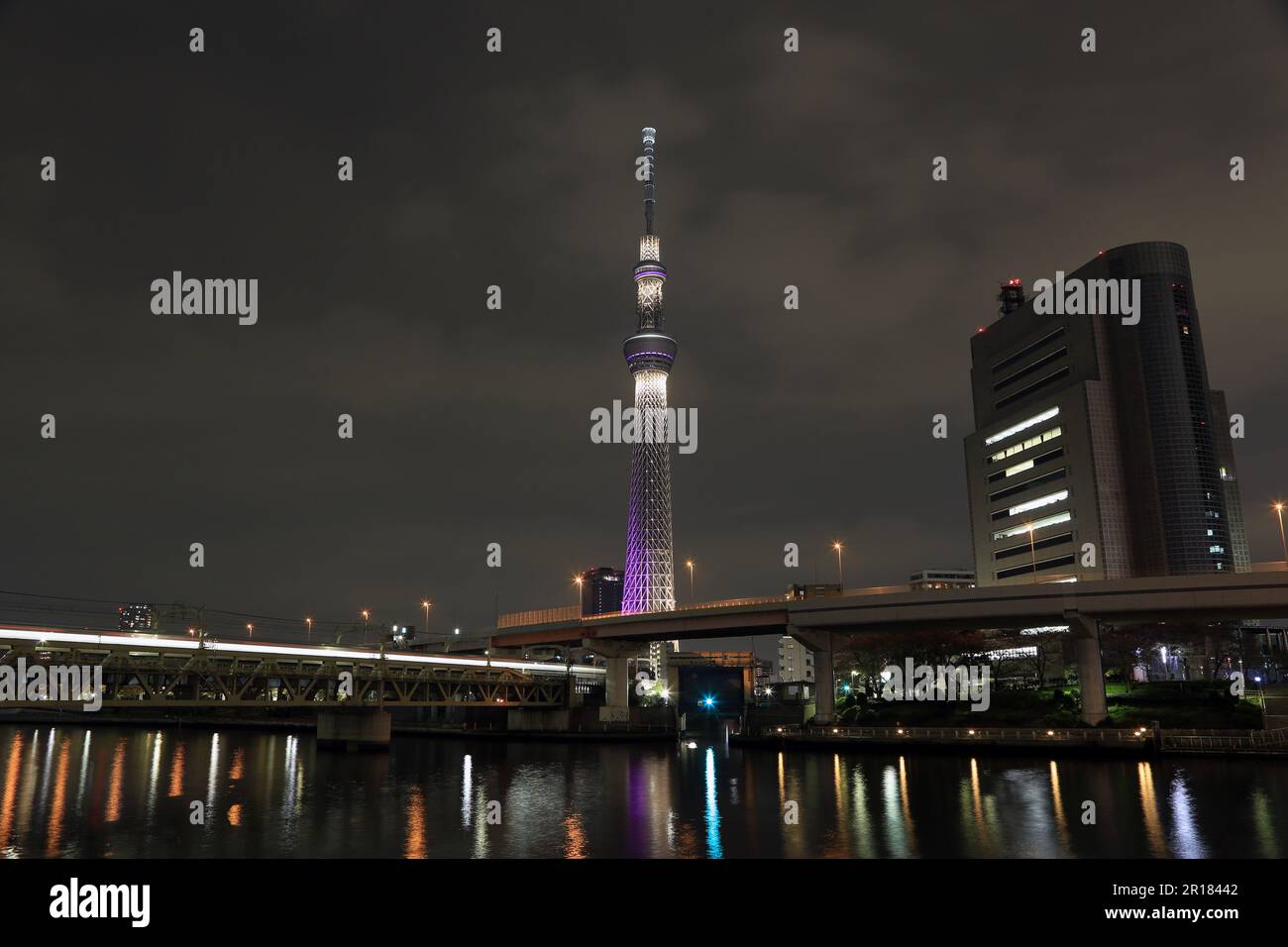 Tokyo sky tree tower lit up in white and purple Stock Photo - Alamy