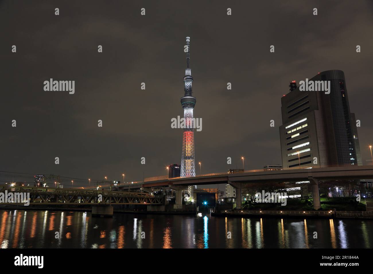 Tokyo sky tree tower lit up in white, Orange and yellow Stock Photo - Alamy