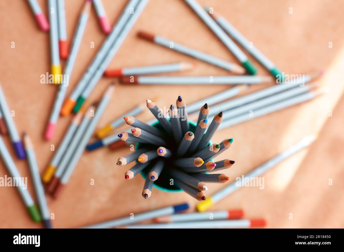 many sharpened colored pencils in a tube top view Stock Photo - Alamy