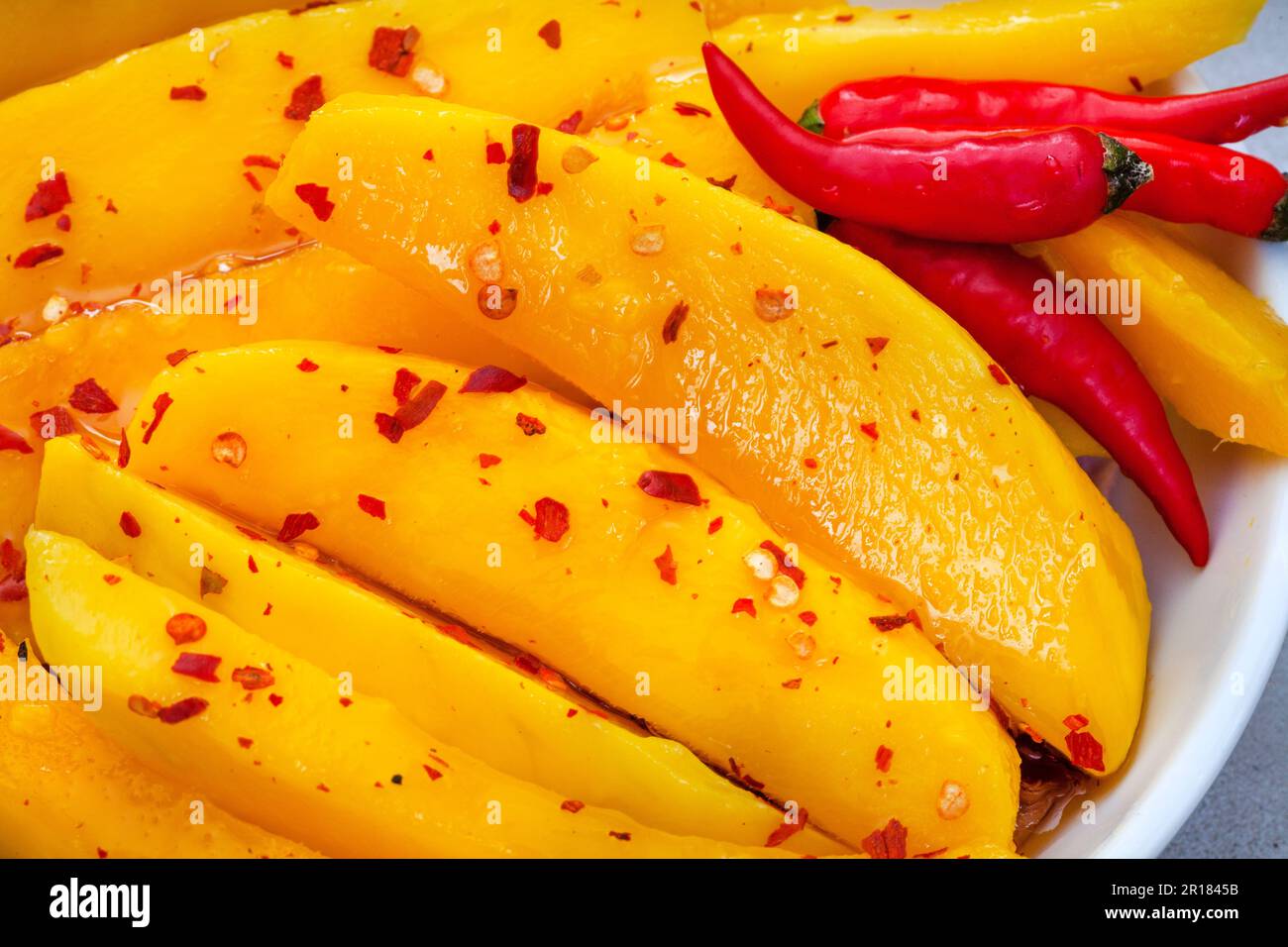 Mango, Chili and honey salad on mottled grey Stock Photo - Alamy
