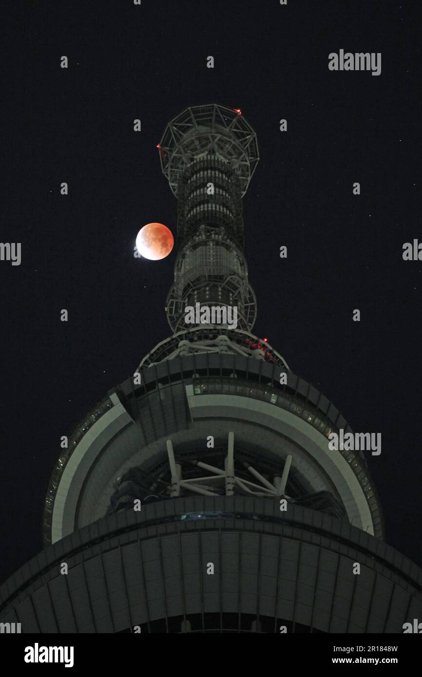 Total lunar eclipse and Tokyo sky tree Stock Photo - Alamy