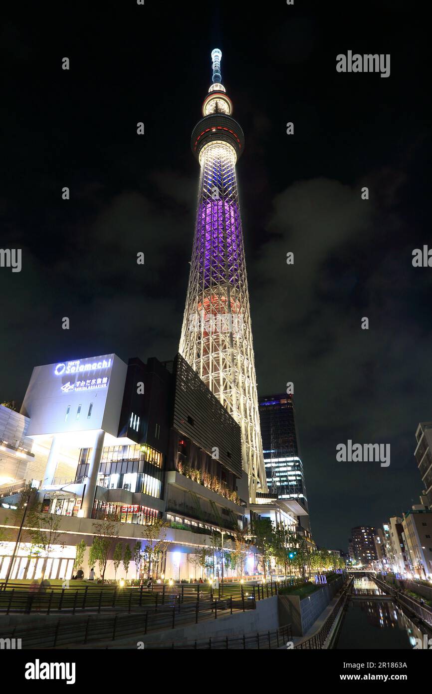 Tokyo Sky Tree was lit up in purple to look up from the vicinity Stock ...