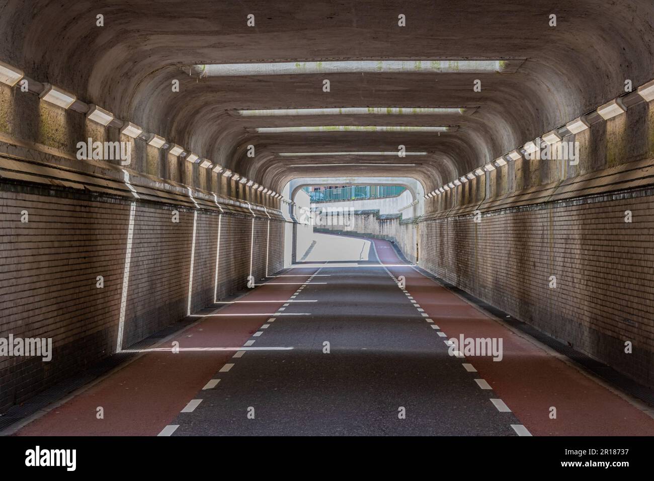 Front view of interior of an empty vehicular tunnel with cycle lanes ...